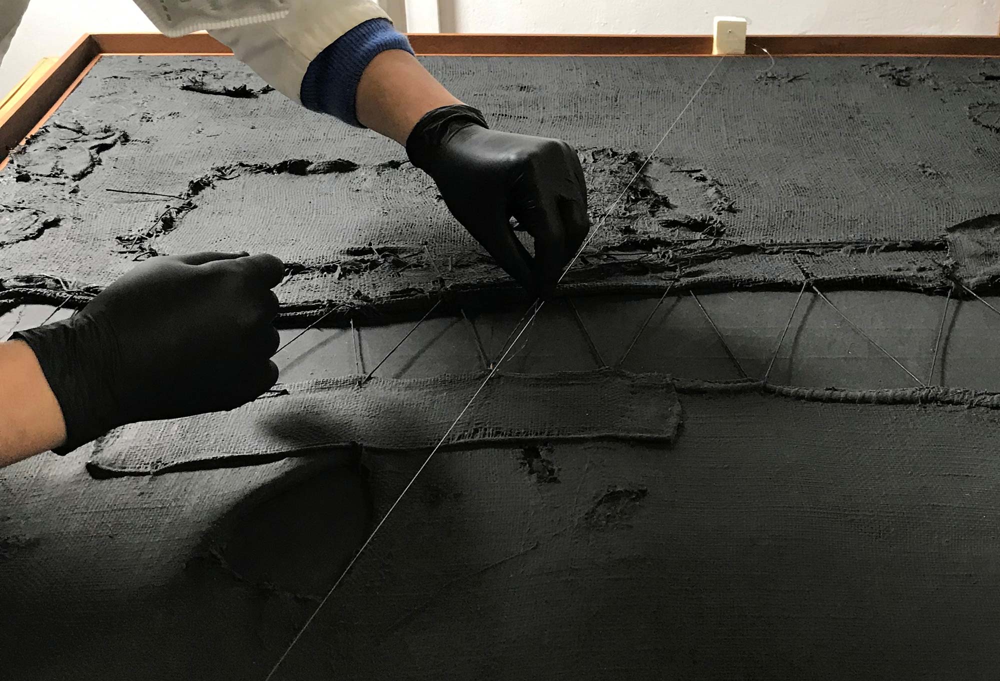 Escaping death: the return of Nero with stitches by Alberto Burri